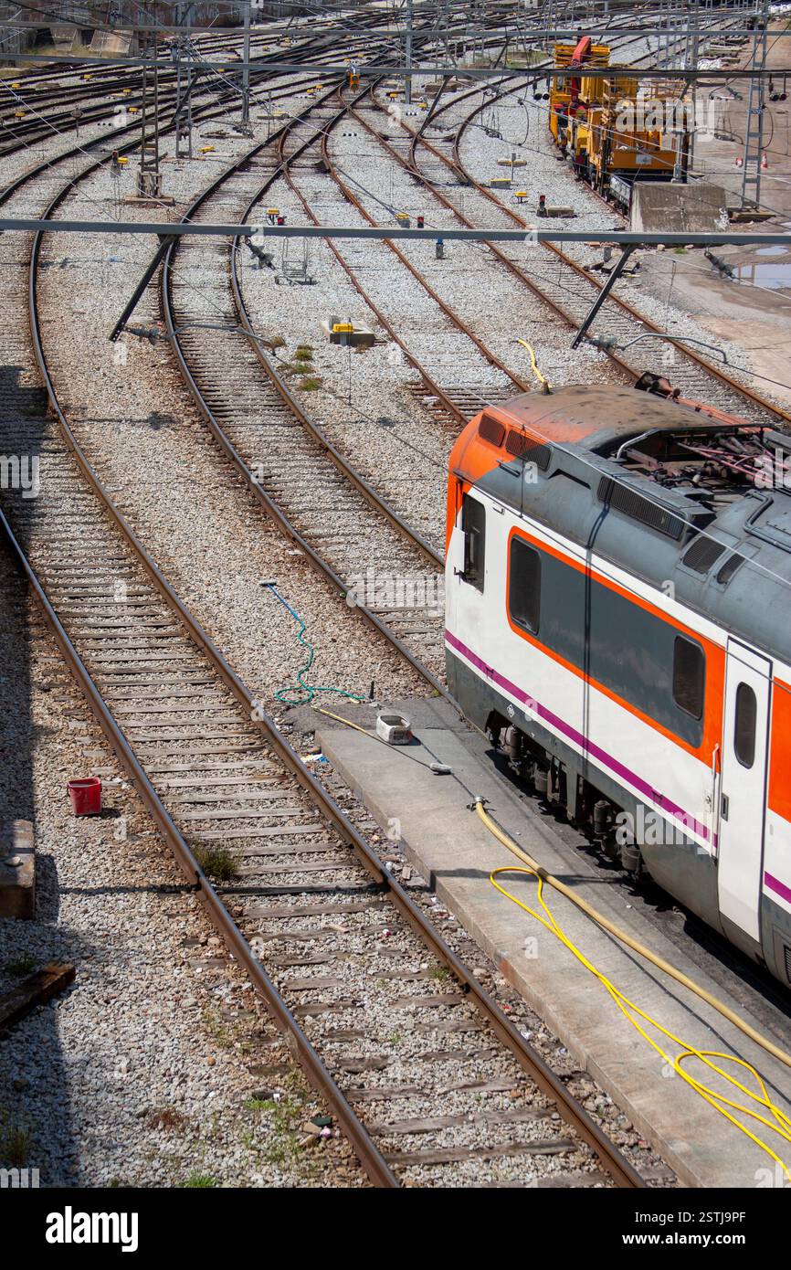 Train tracks and a parked train. Railway infrastructure, transportation ...