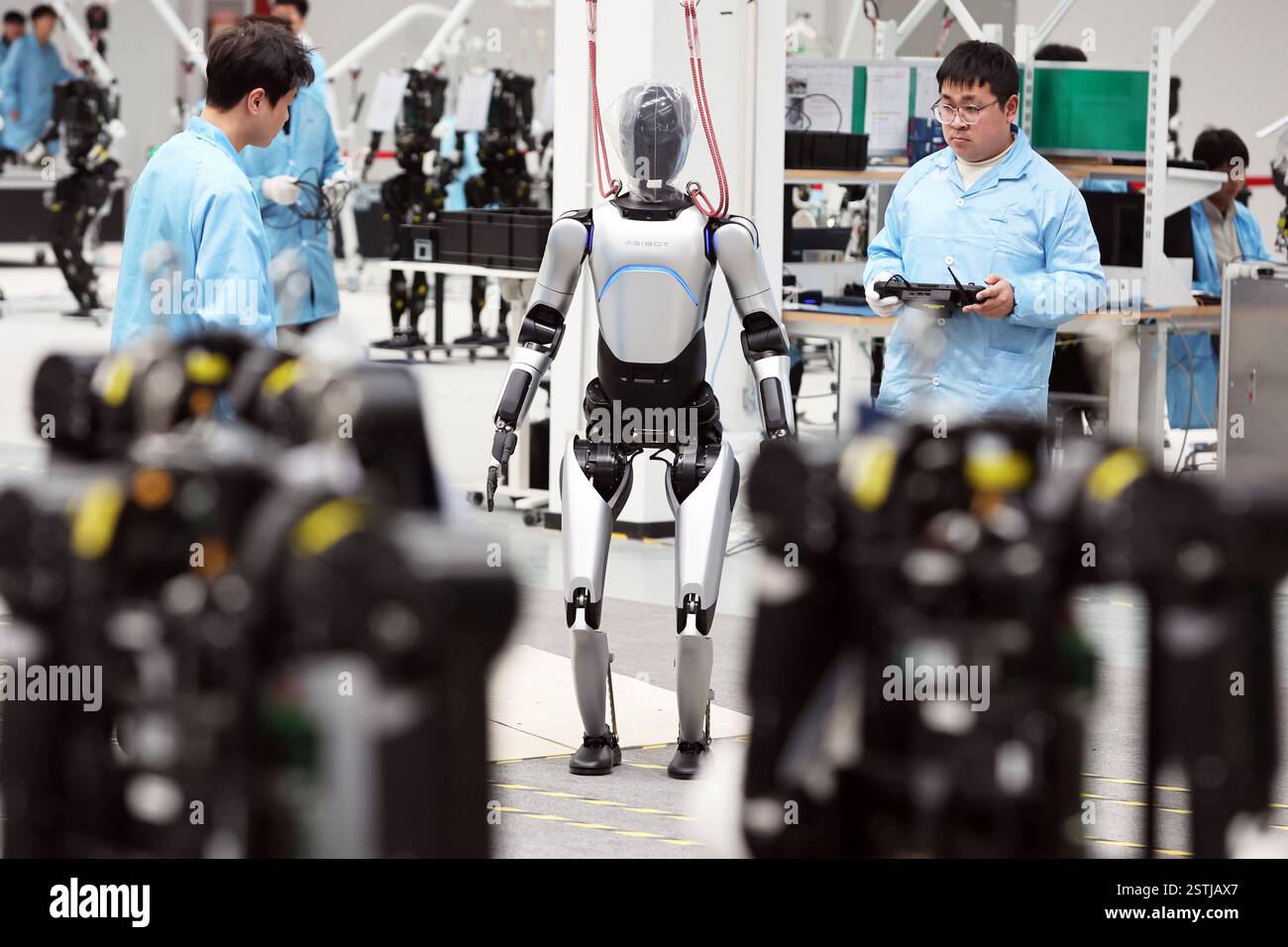 Shanghai,China.18th February 2025. Engineers train humanoid robots at ...