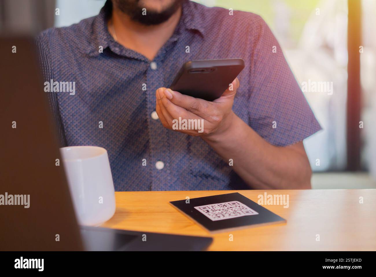 Man use smartphone to scan QR code for choose menu and order menu in ...
