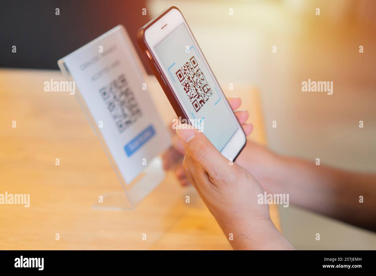 QR code payment and cash technology concept. Side view of men's hands ...
