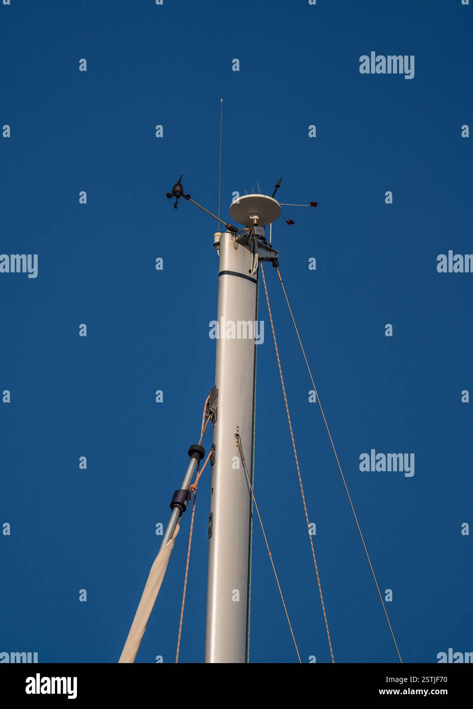 Tall mast large yacht reaching into clear blue sky, showcasing elegance ...