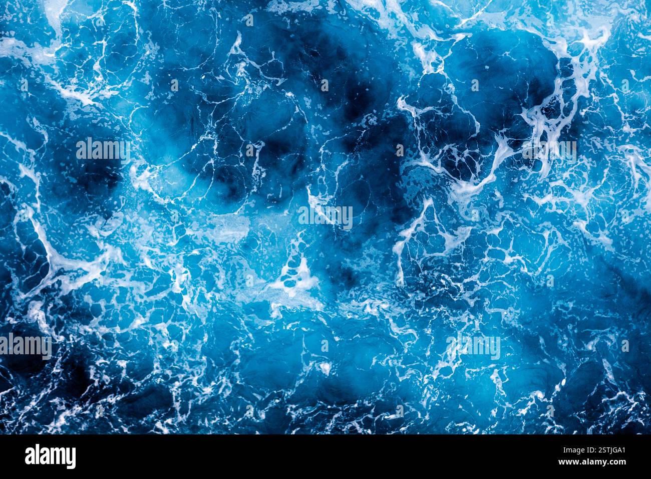 Ocean water surface texture. Aerial view of stunning water with foam ...