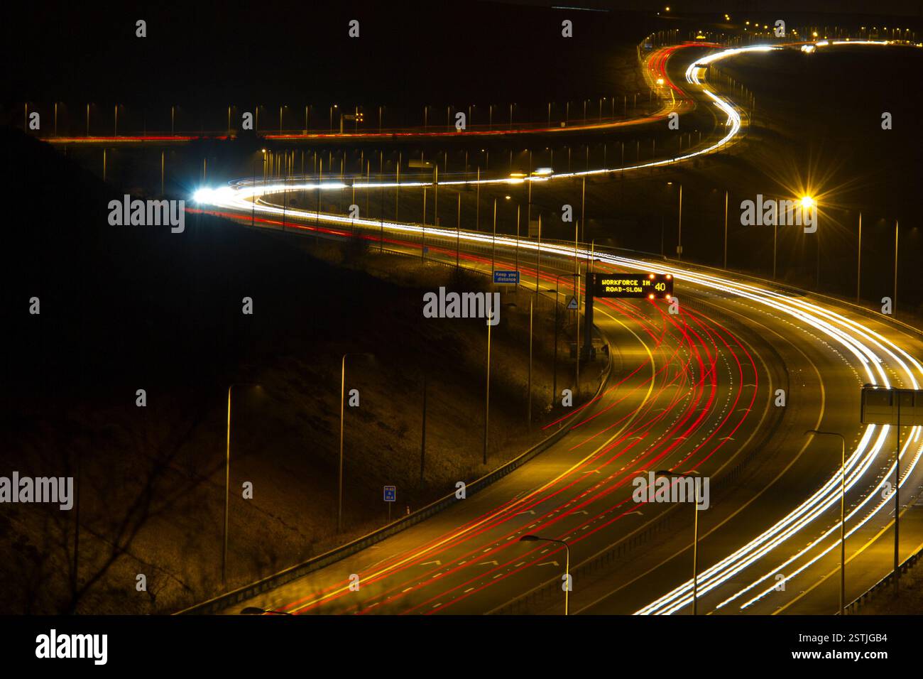 light trails on motorway highway at night Stock Photo - Alamy