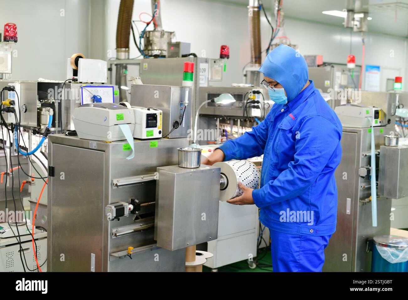 Workers produce an externally controlled anti-mildew preservative on a ...