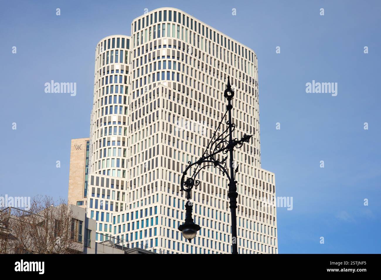The Upper West (Atlas Tower) in Berlin with an old street lantern as a ...