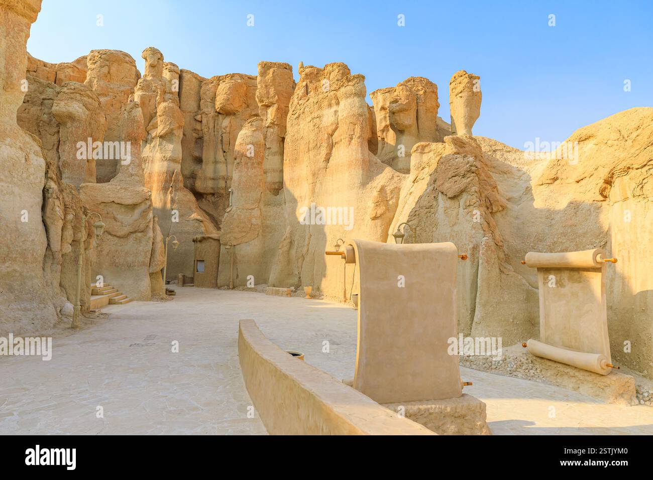 Stone scrolls and panels resembling ancient manuscripts line the ...