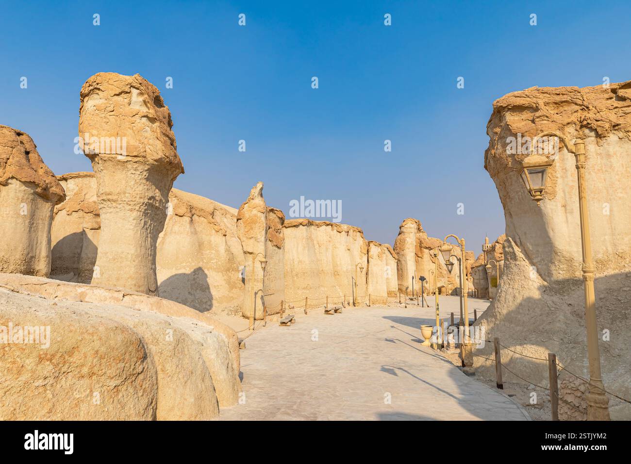 Sunlight illuminating Jabal Al Qarah mountain rock caves and walking ...