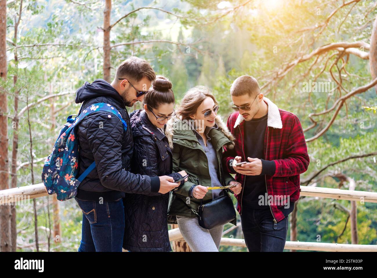 Four tourists trying to find the way Stock Photo - Alamy