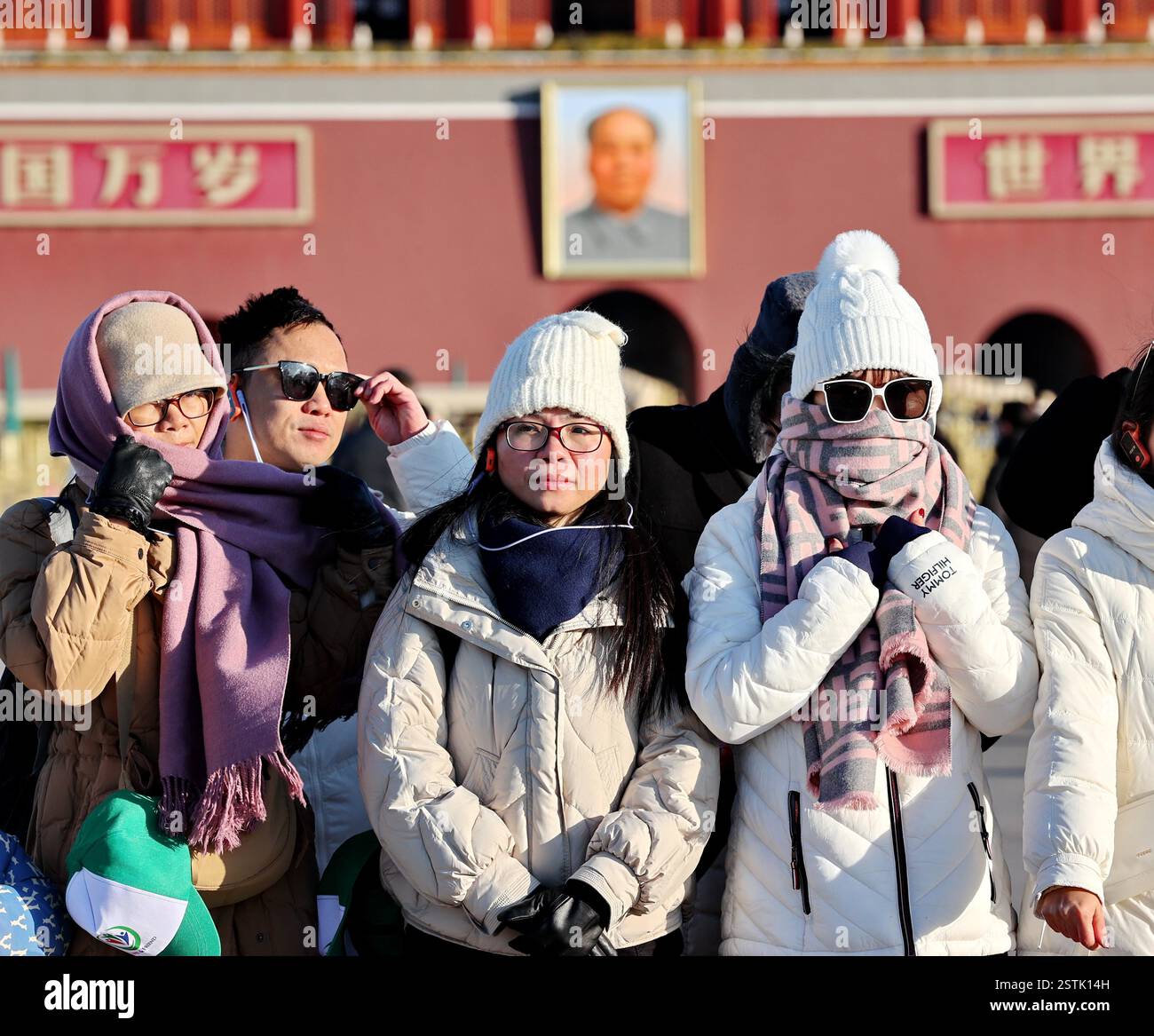 Tourists visit the Tiananmen Square amid cold air in Beijing, China, 16 ...