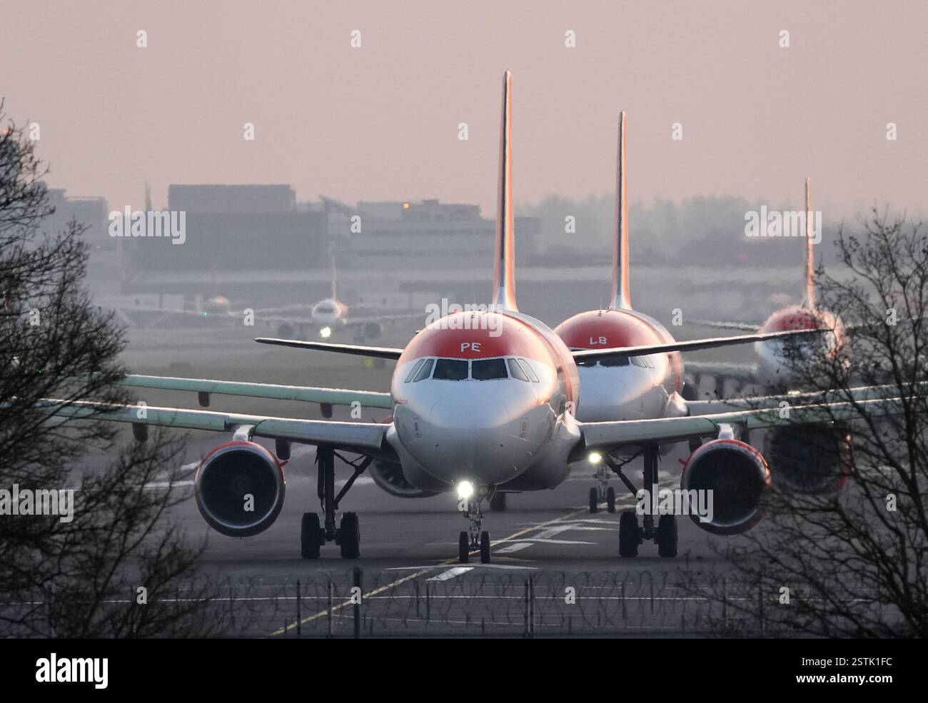 EasyJet planes queue to take off at London Gatwick Airport in Crawley ...