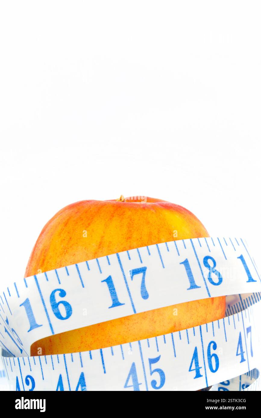 Apple with tape measure Stock Photo - Alamy