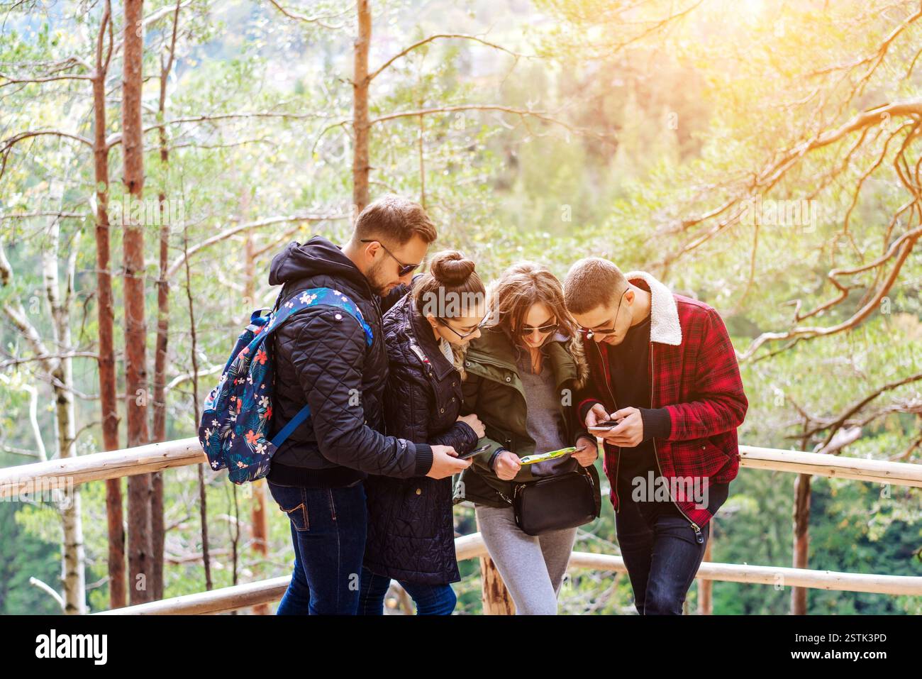 Four tourists trying to find the way Stock Photo - Alamy