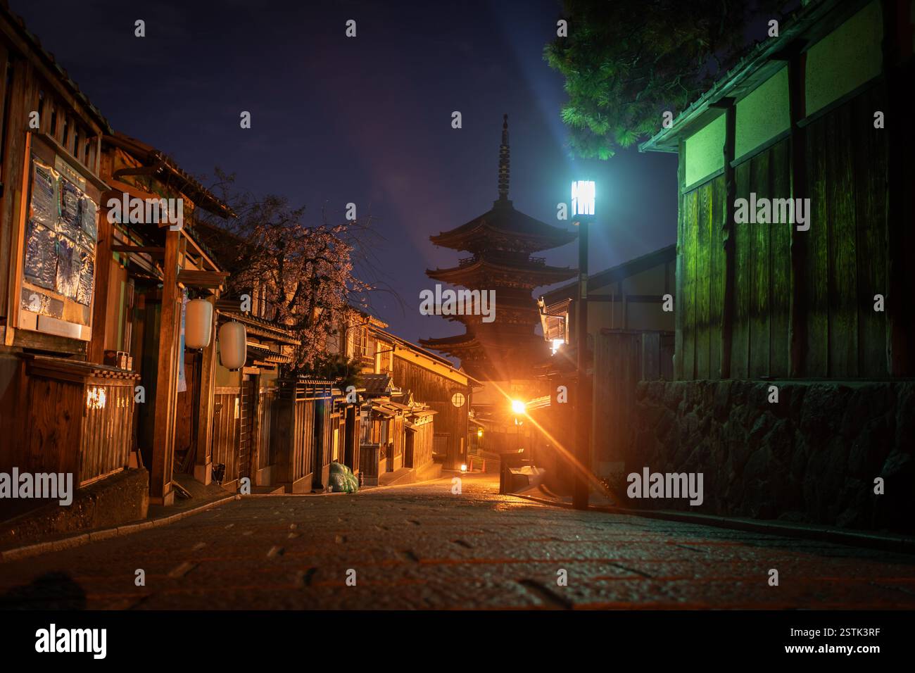 Kyoto, Japan, 4-3-2024: rare night view of Yasaka Pagoda, Gion geisha district, during hanami ...