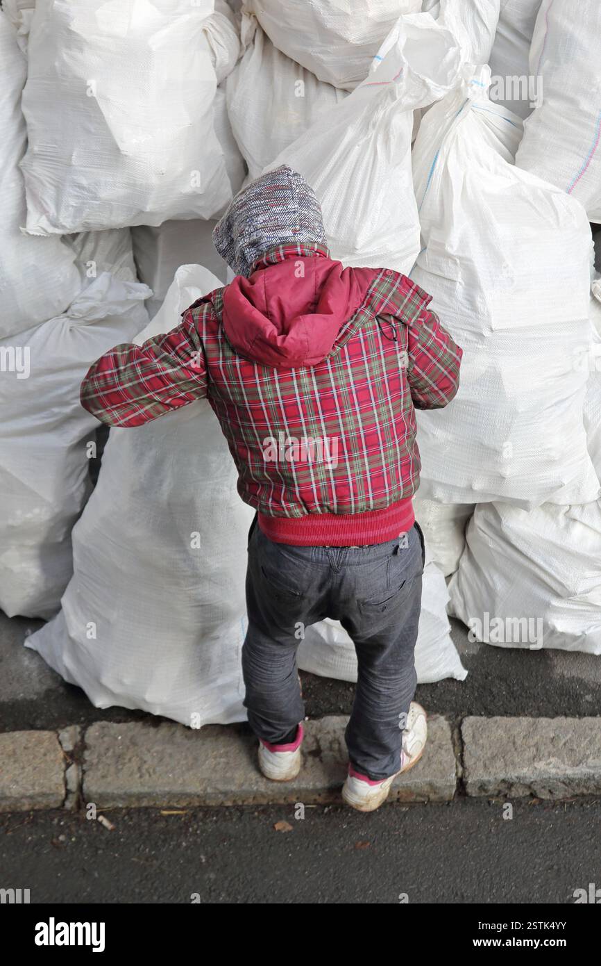 Man looking pile trash hi-res stock photography and images - Alamy