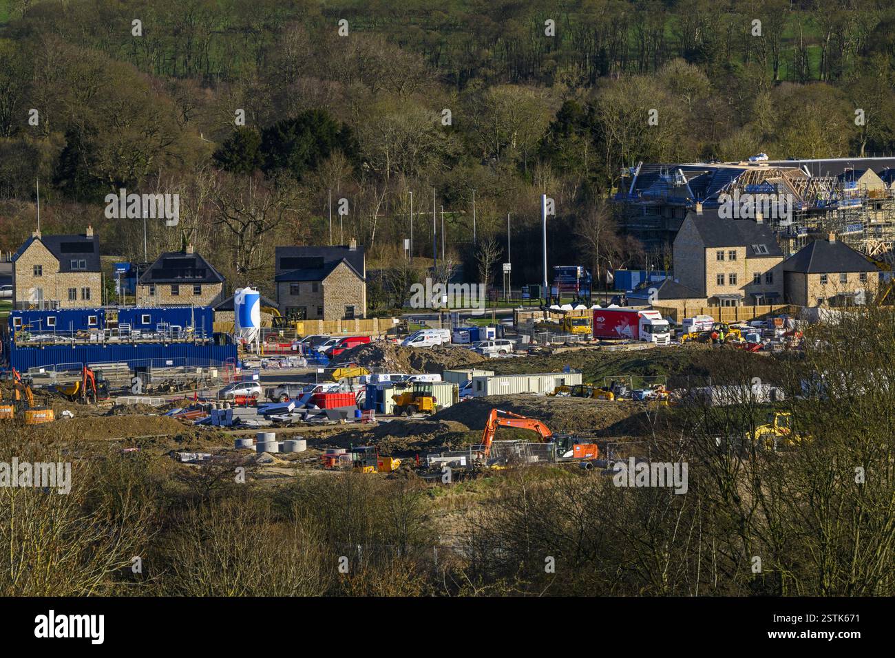 Building constructing houses in scenic rural valley (newly built, loss ...