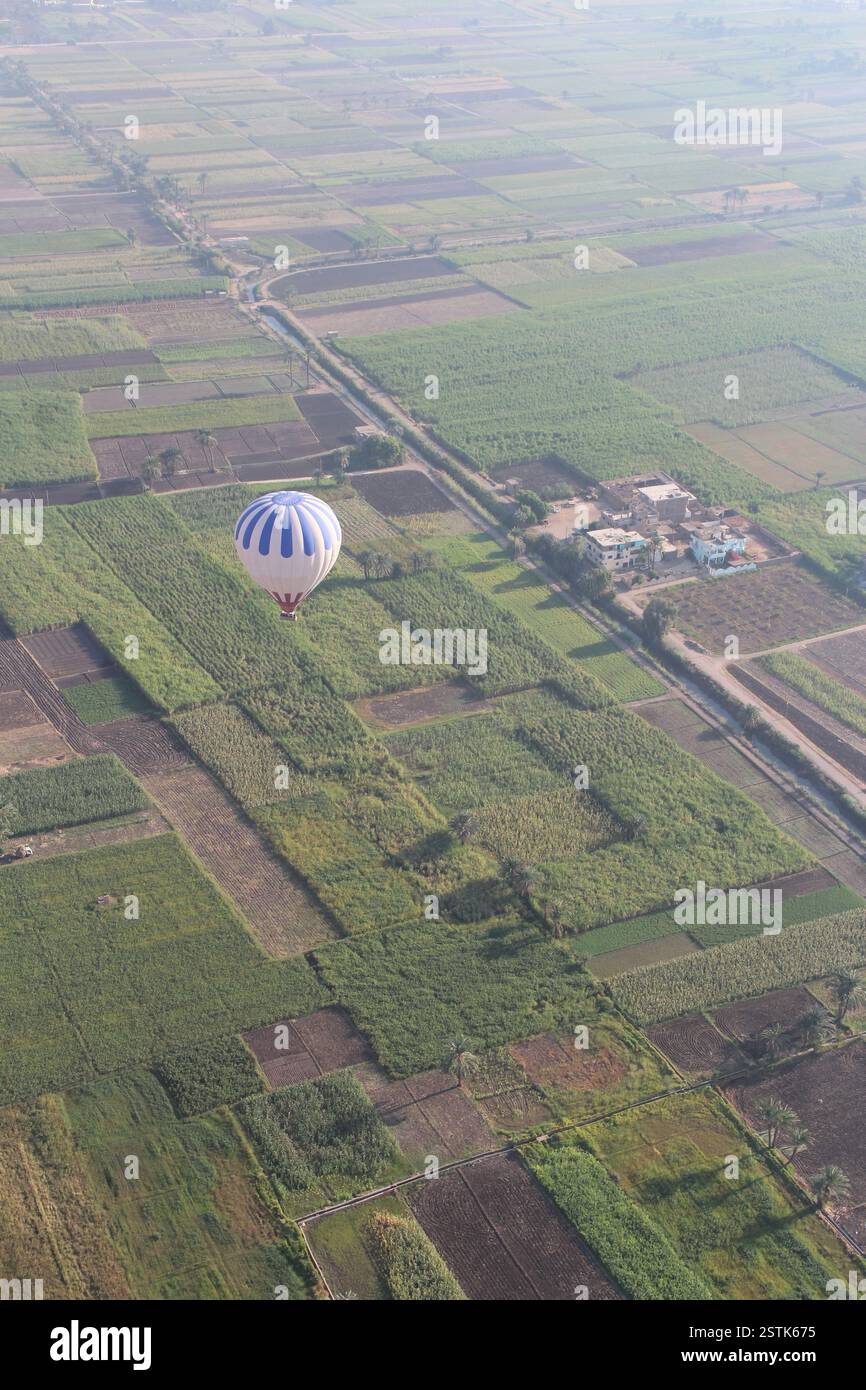 Aerial view of the crops on East bank with the hot air balloons in the ...