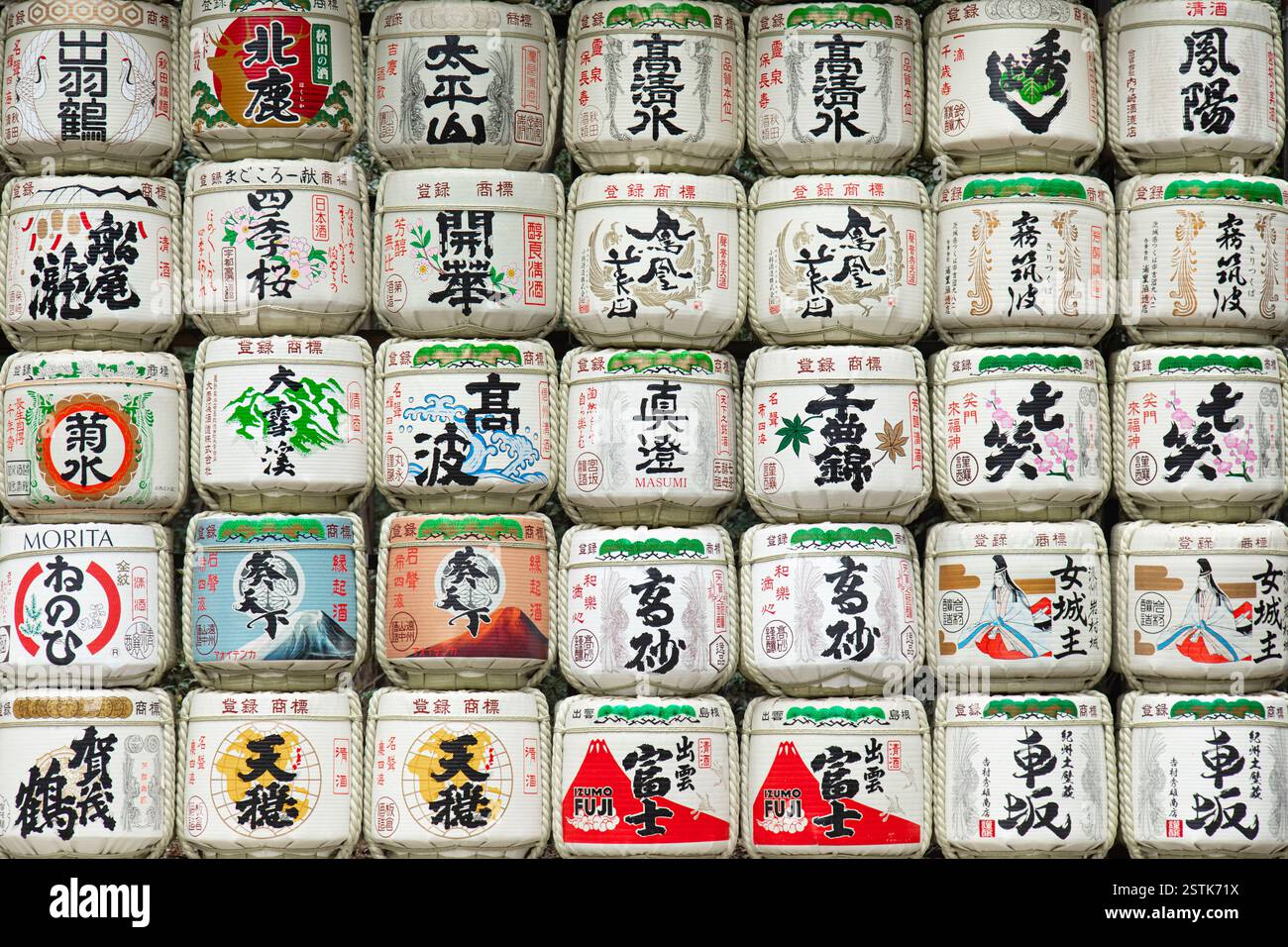 Tokyo, Japan, 5-4-2024:Stacked sake barrels, decorative kanji labels ...
