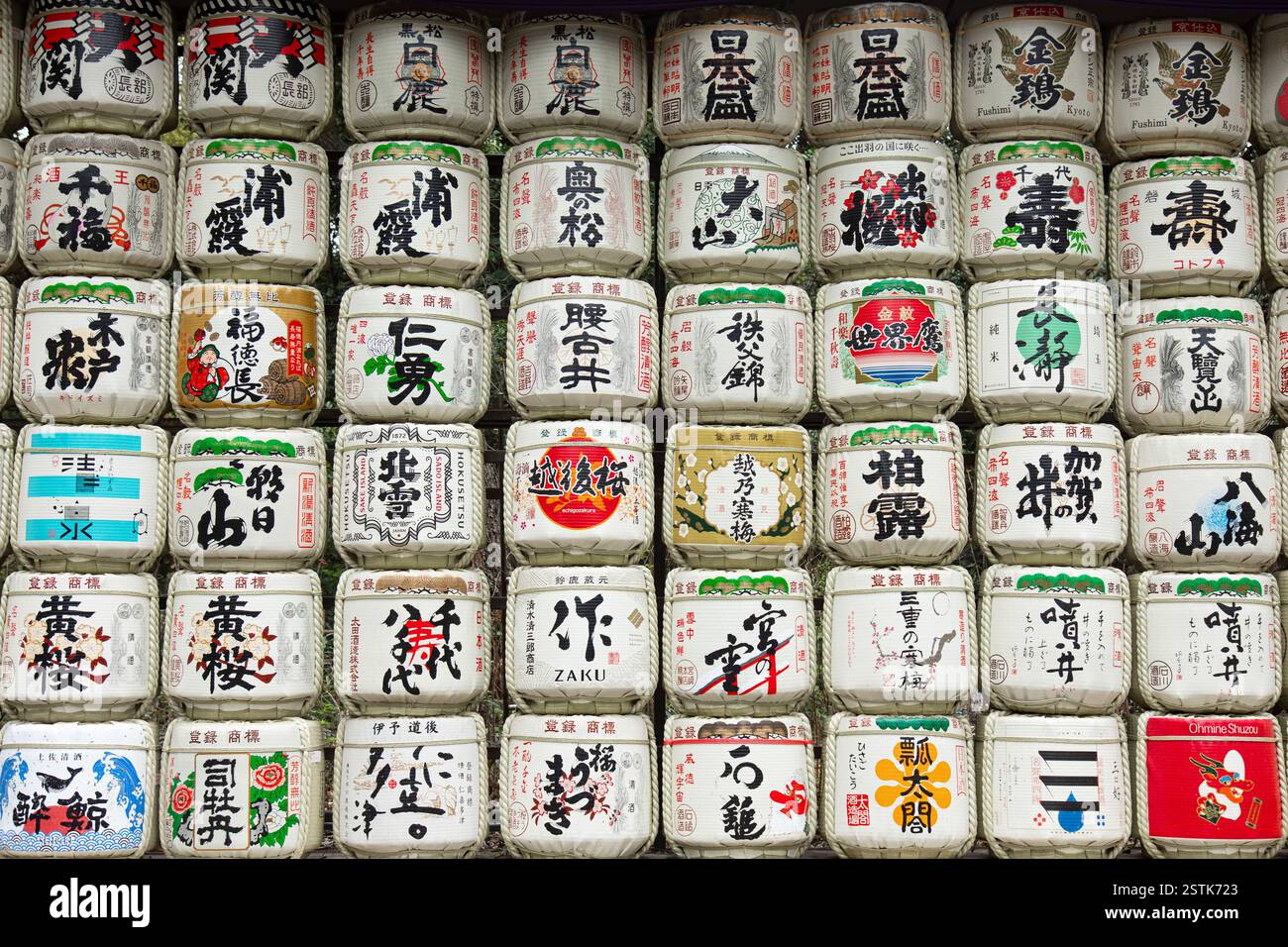Tokyo, Japan, 5-4-2024:Stacked sake barrels, decorative kanji labels ...