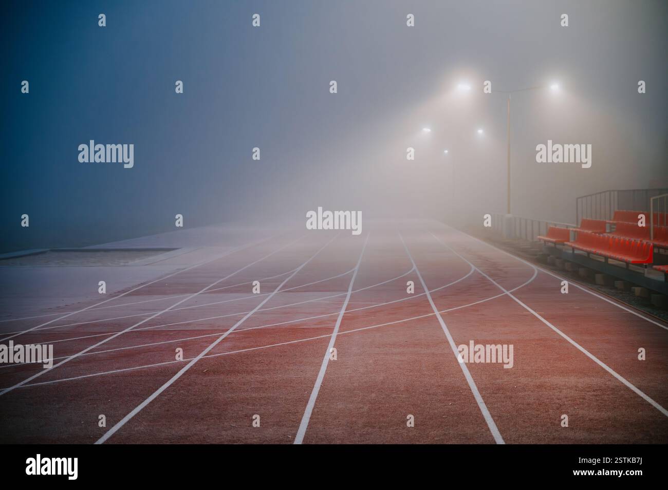 Frozen Running track in morning winter mist Stock Photo - Alamy