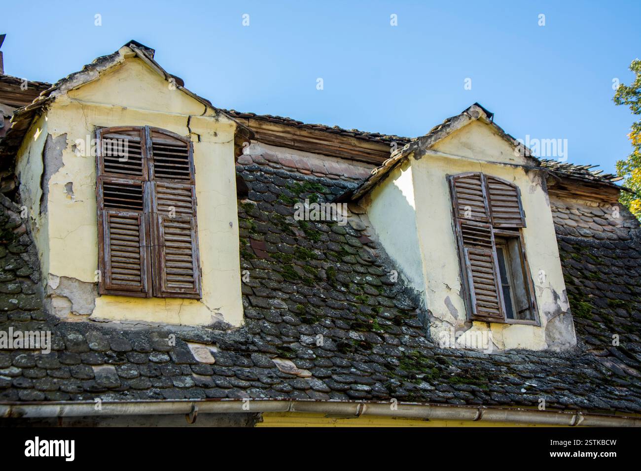 Old two dormer attic windows with wooden shutters Stock Photo - Alamy