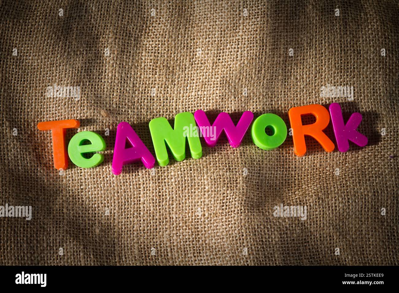 Teamwork Dictionary Definition Low key close up Stock Photo - Alamy