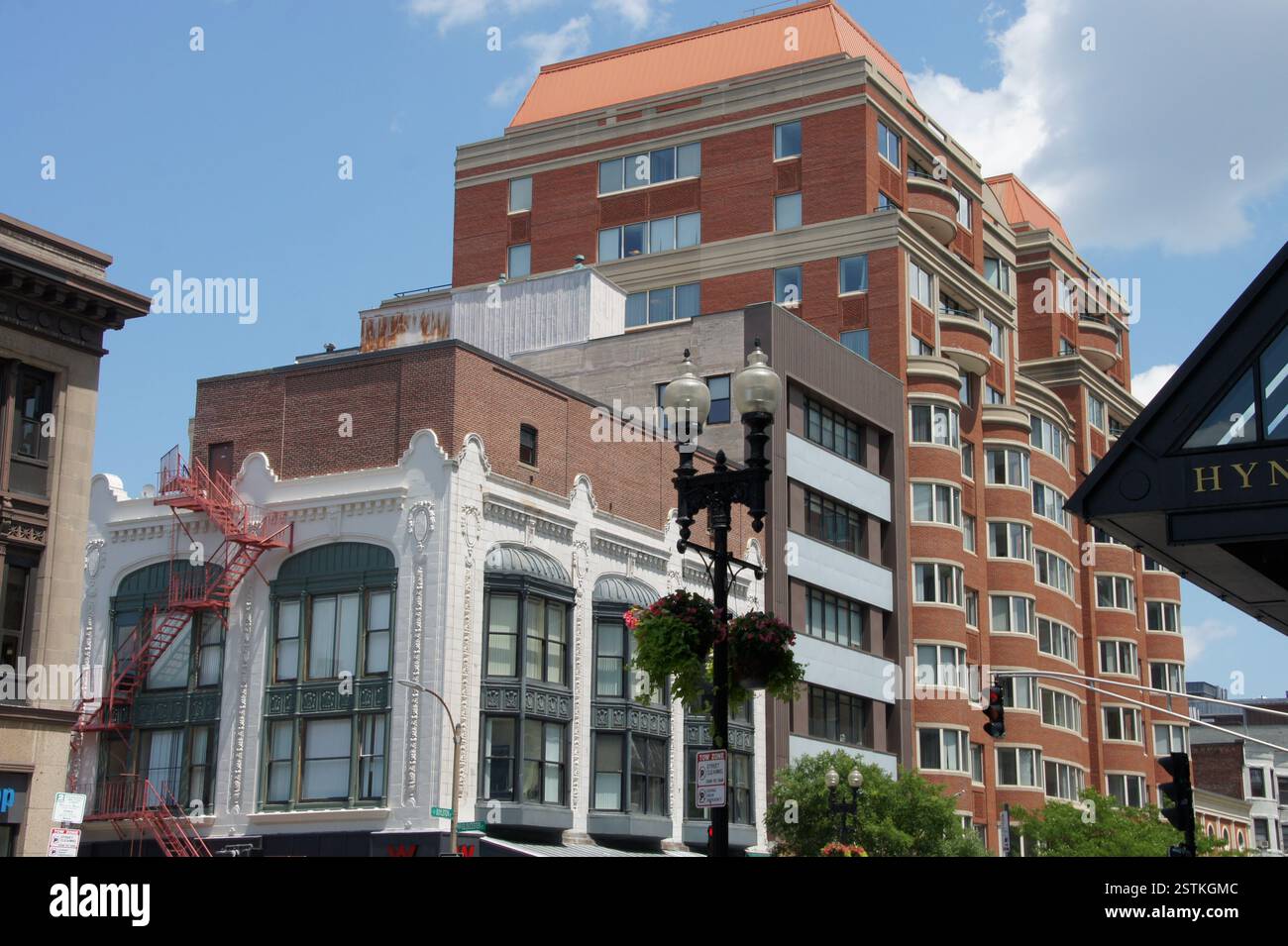 Boston Red brick building with white trim. Blue sky with clouds. HYN ...