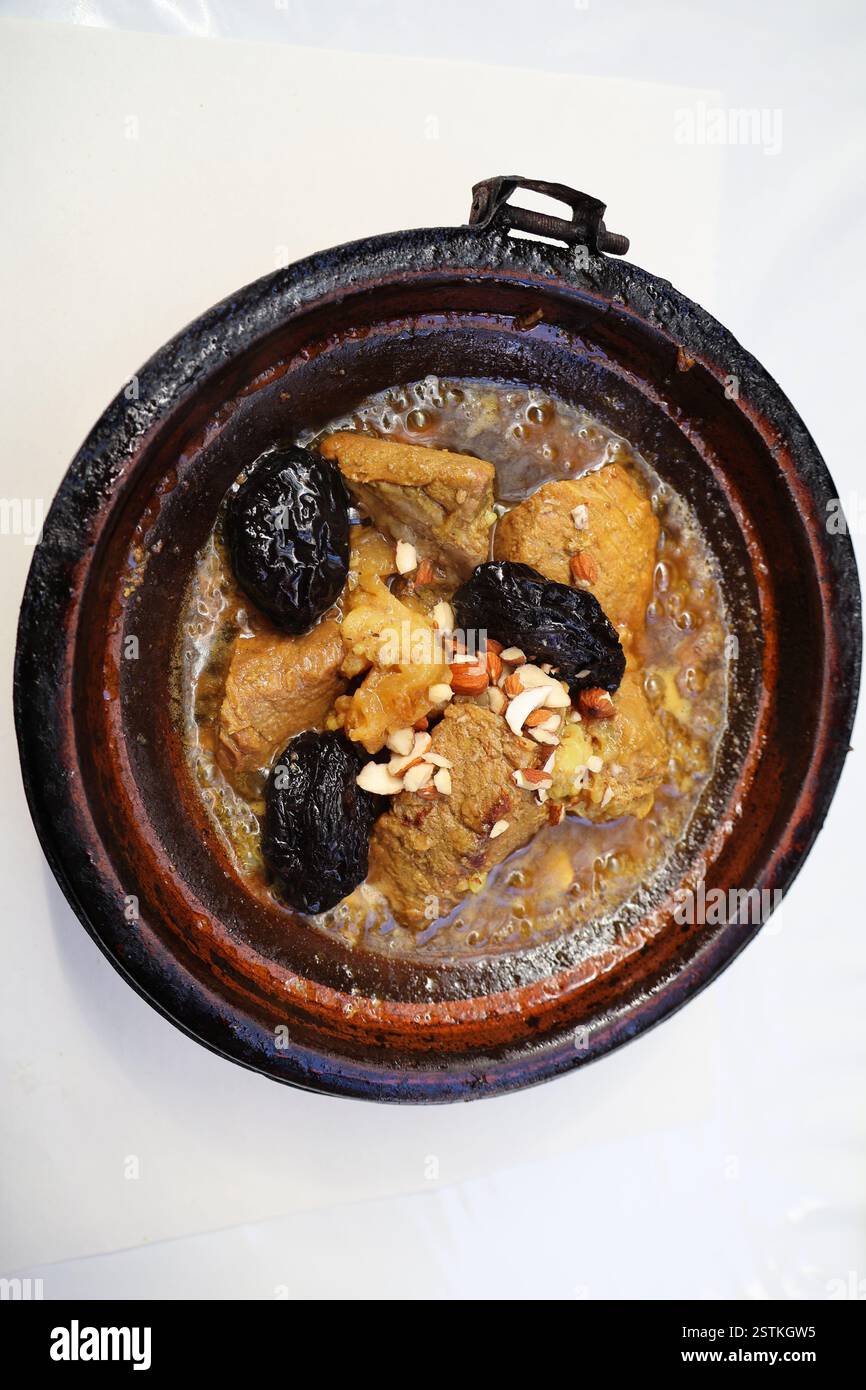 Moroccan beef prune and almond tagine Stock Photo - Alamy