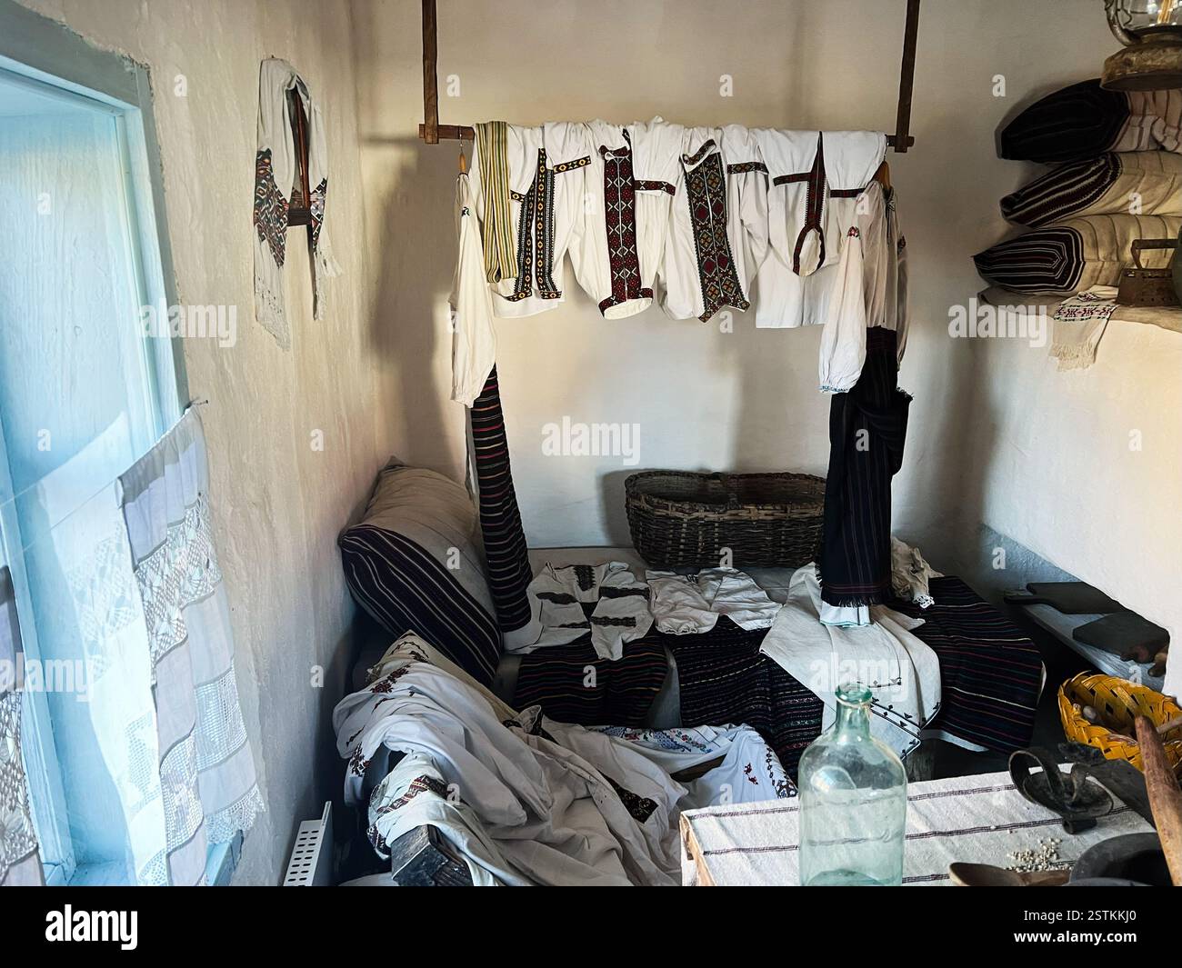 Authentic setup of traditional clothes and fabrics in a cultural ...