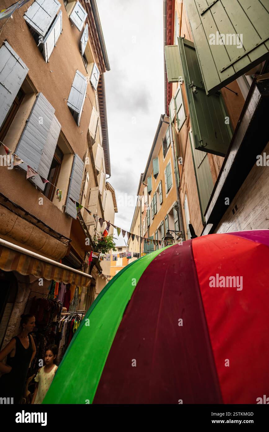 Charming Street Scene in Menasque, Provence with Colorful Umbrella ...