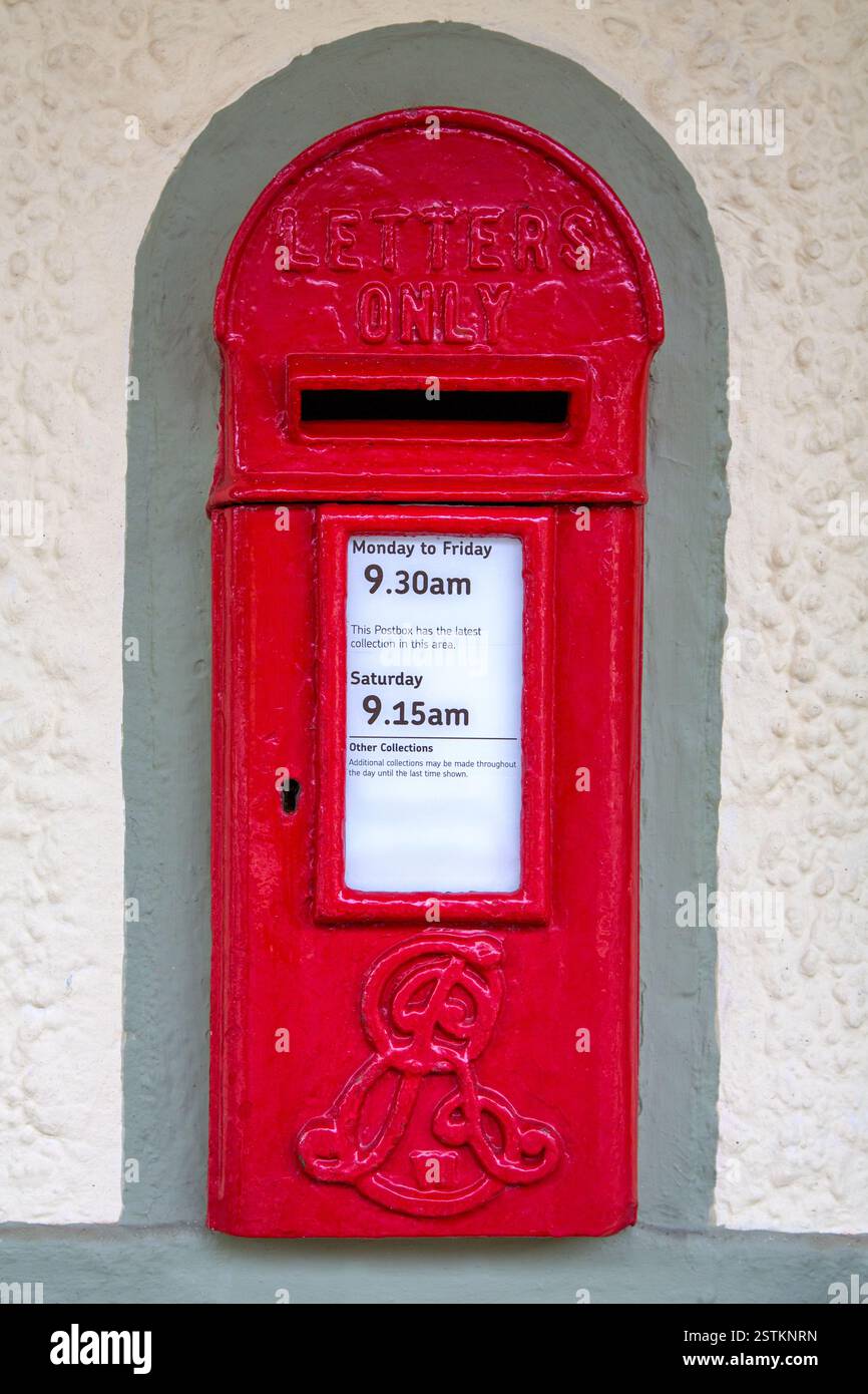 Edwardian postbox set into a wall. Traditional red British letter box ...