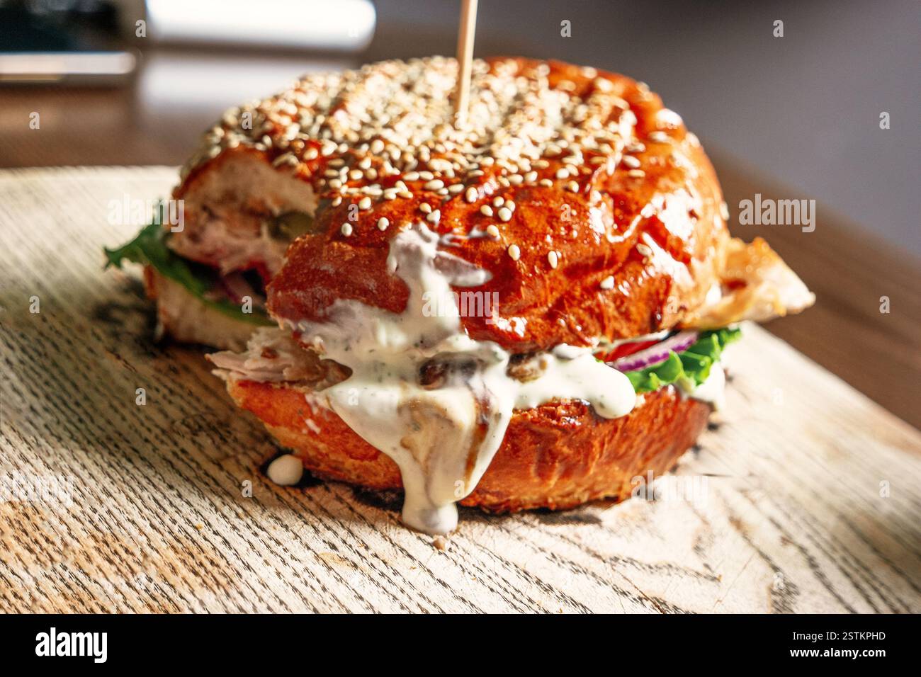 Fast food burger bitten off Stock Photo - Alamy