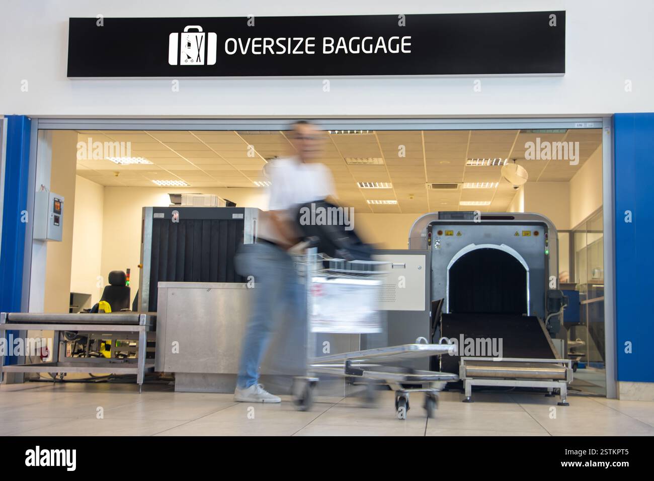 Passengers with luggage leave the airport oversized baggage counter ...