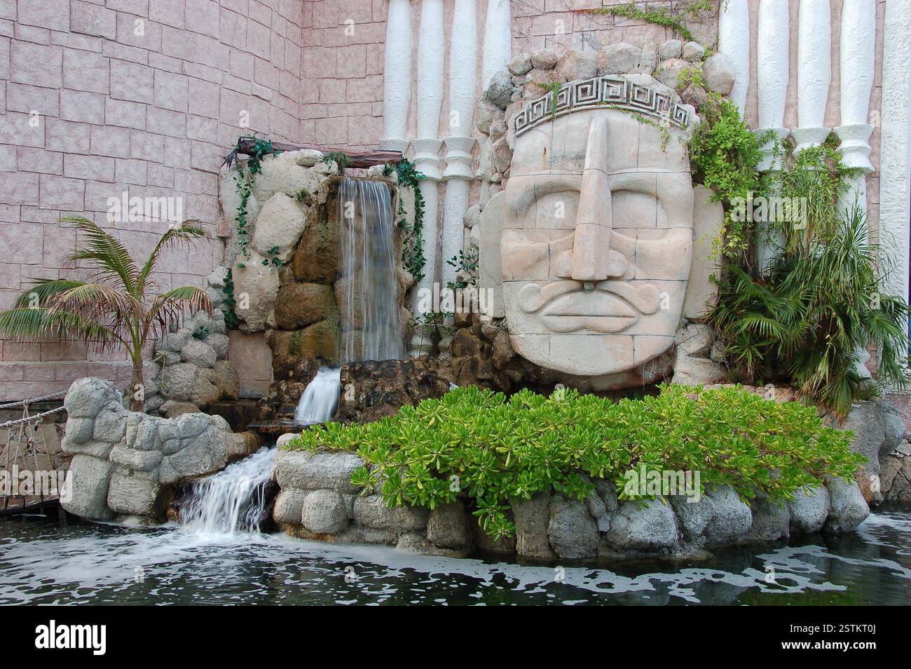 Mayan-inspired stone face carving in a Cancun shopping center ...