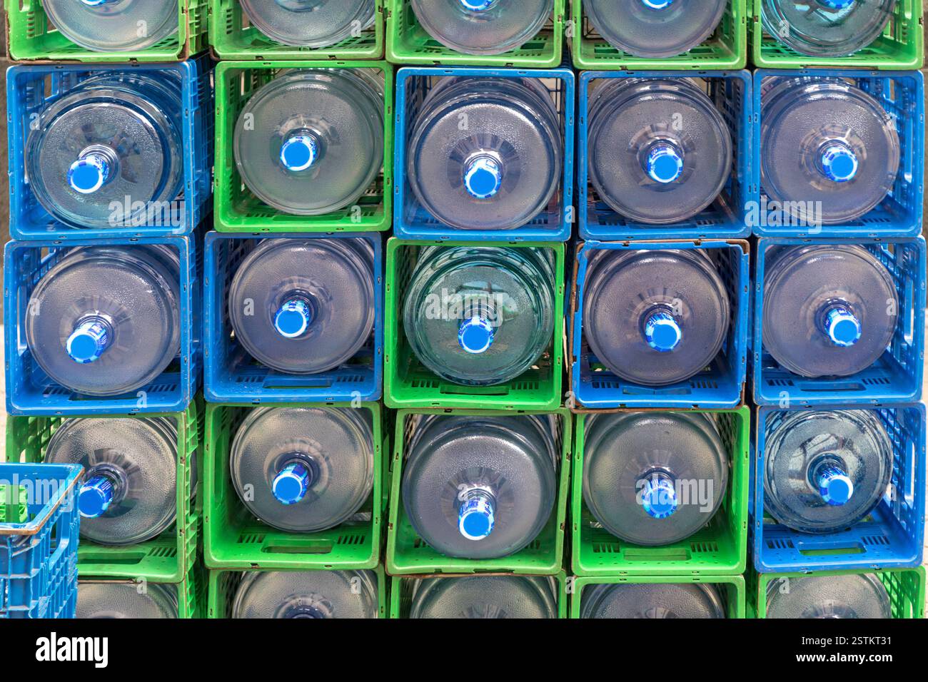 Stack of filtered bottled water in crates delivery hi-res stock ...