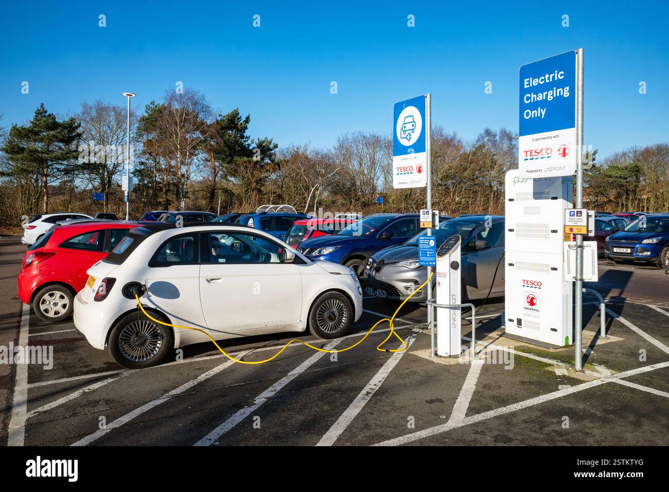 Electric cars change points Tesco supermarket Stock Photo - Alamy