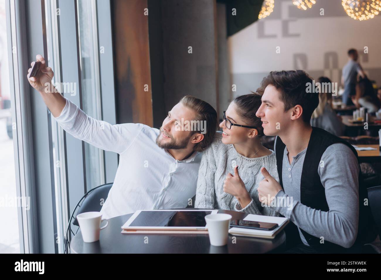 Three successful business people taking Selfie Stock Photo - Alamy