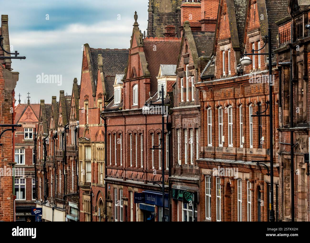 Ornate rooftops and building facades of Moorgate Street in Rotherham ...