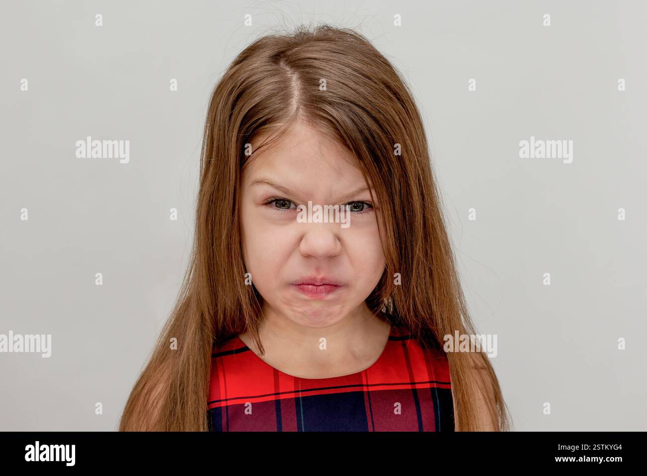 Squeamish caucasian child of 6 7 years on white background Stock Photo ...