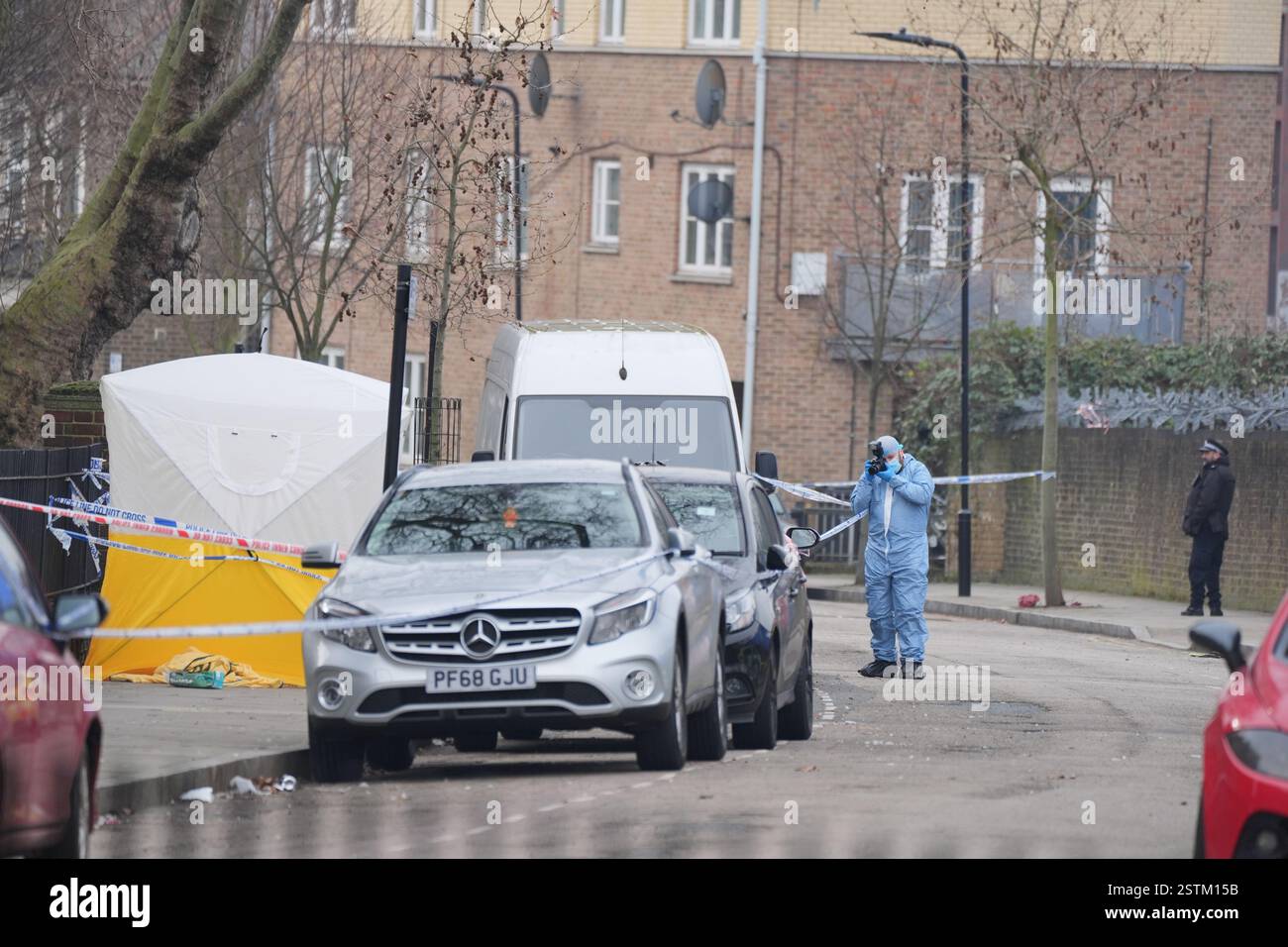 Police at the scene on Bodney Road in Hackney, east London, after the murder of a 20-year-old ...