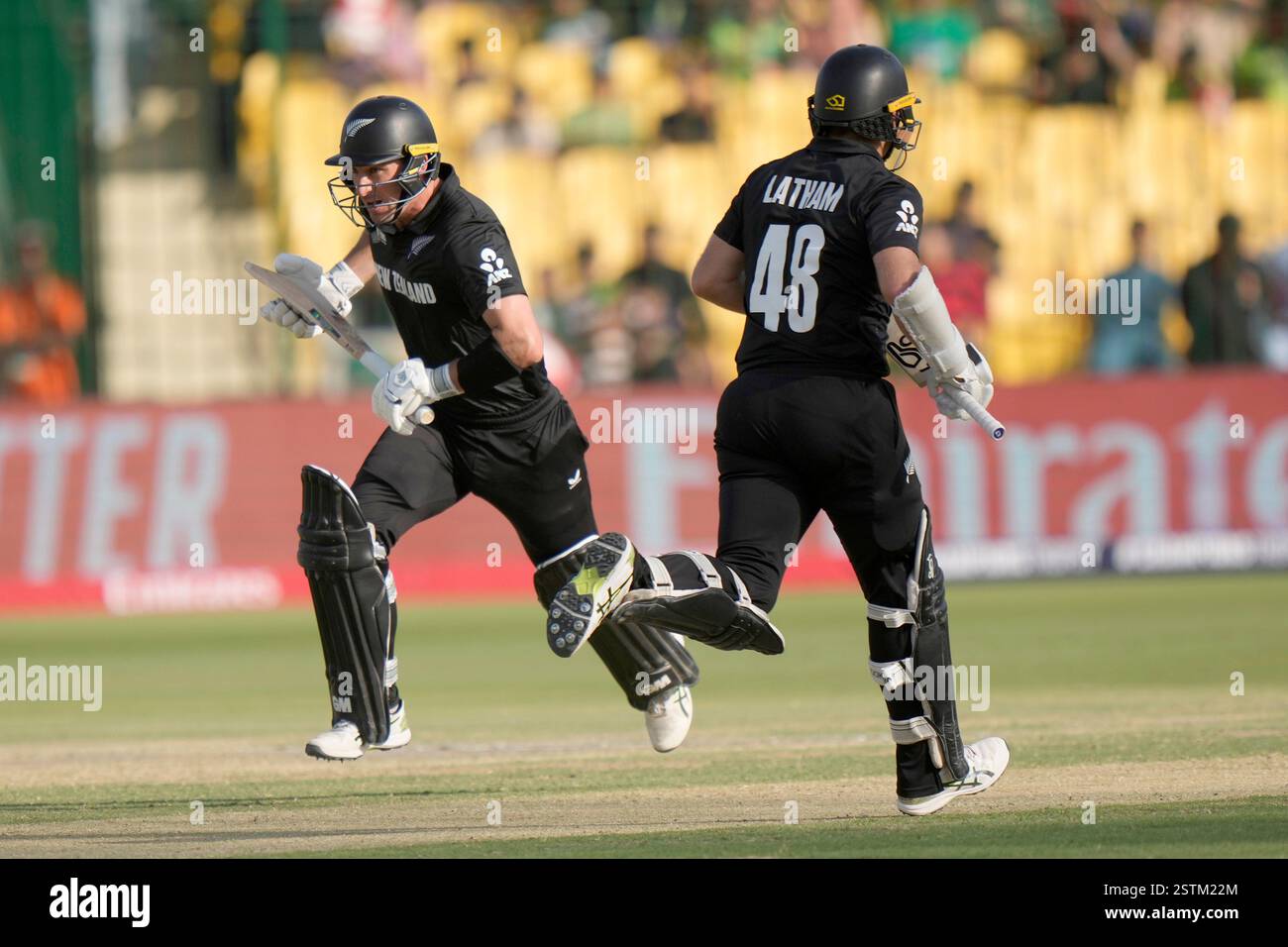 New Zealand's Will Young, left, and Tom Latham run between the wickets ...