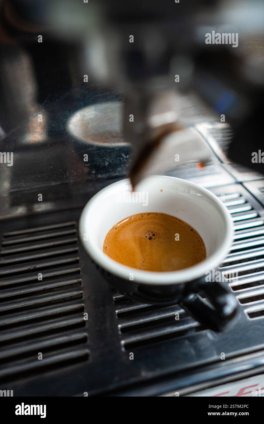 Little cup of espresso standing in the steel coffee machine Stock Photo ...