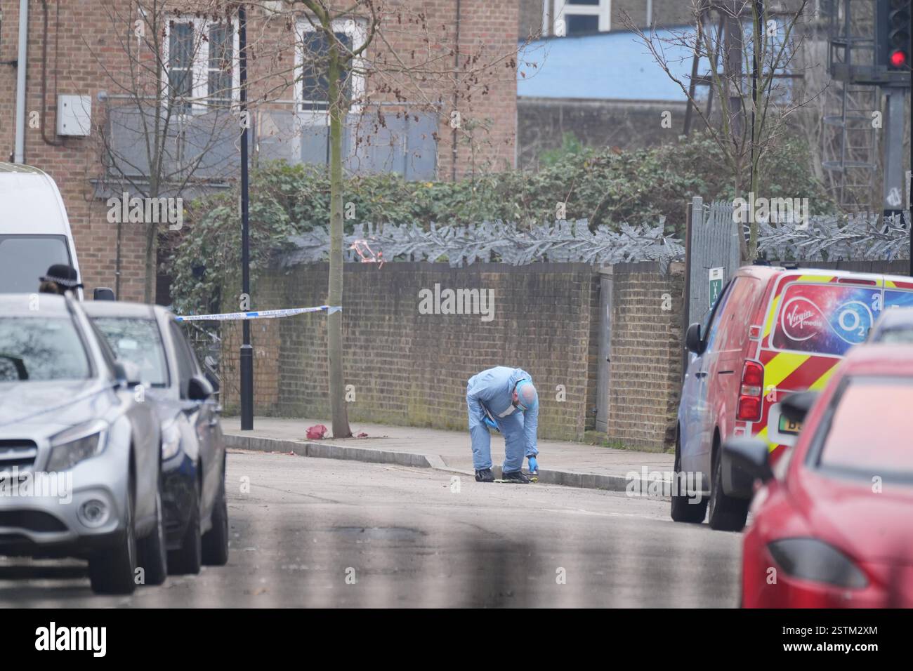 Police at the scene on Bodney Road in Hackney, east London, after the murder of a 20-year-old ...