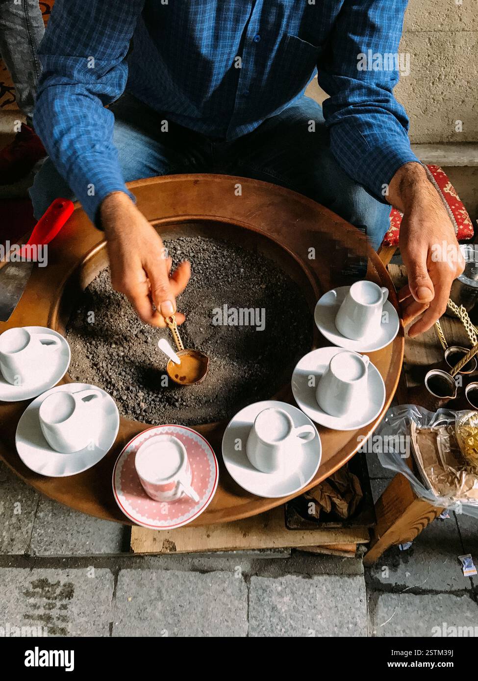 A man make Turkish coffee Stock Photo - Alamy