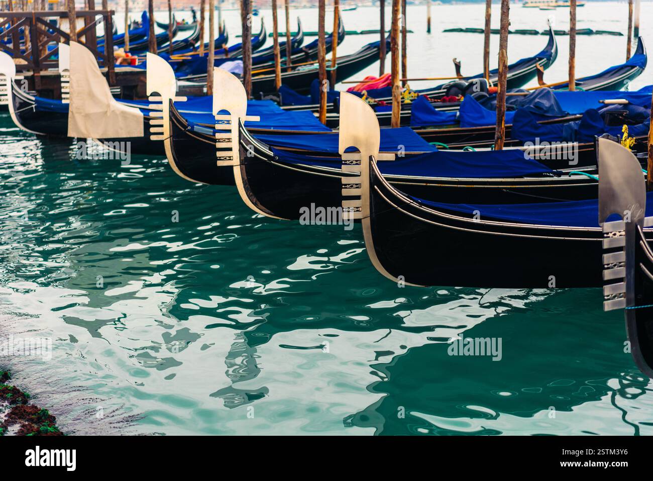 Rows of traditional wooden gondolas Stock Photo - Alamy