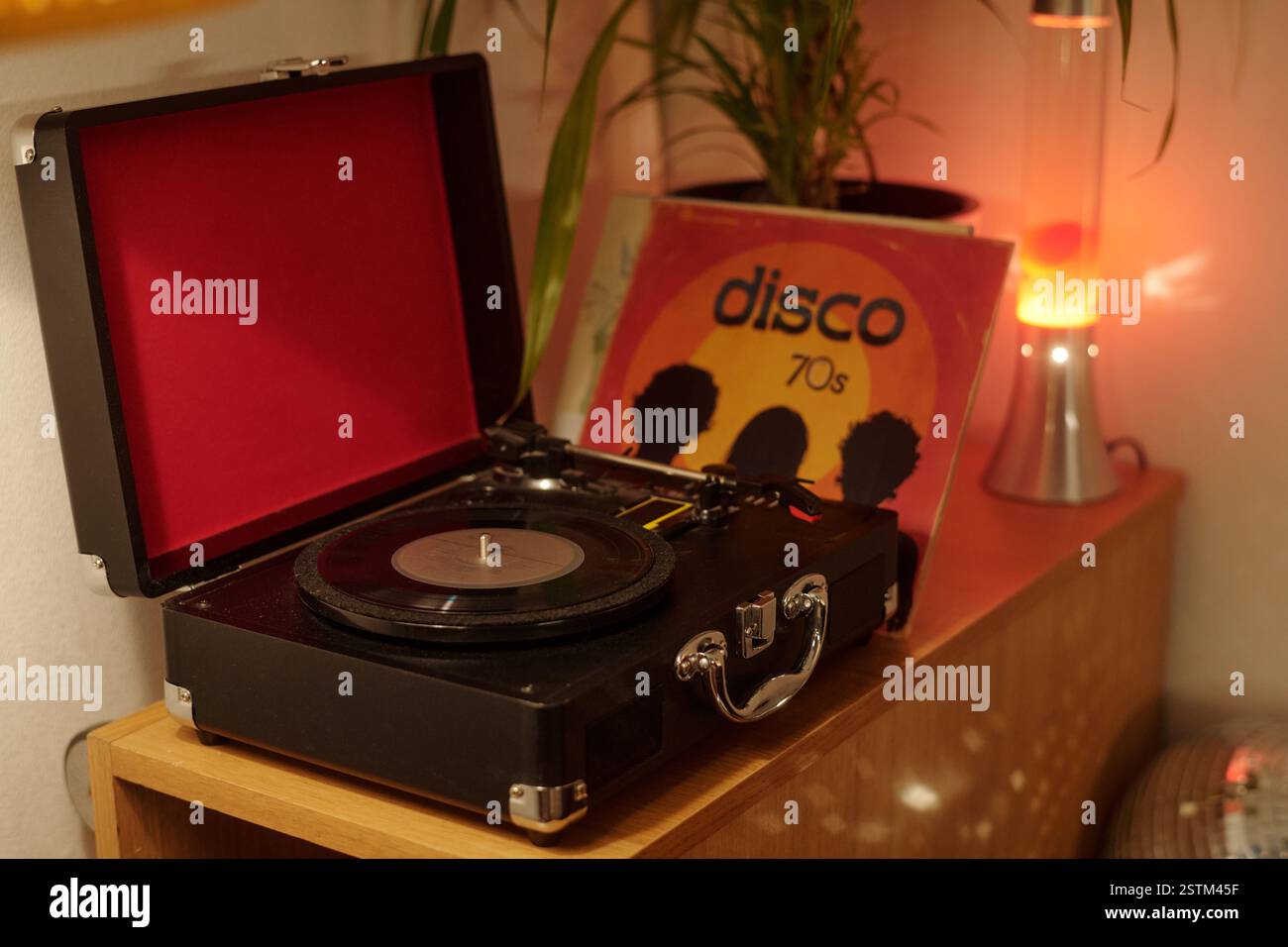 Playing Vinyl Record on Retro Turntable with Disco Album Stock Photo ...