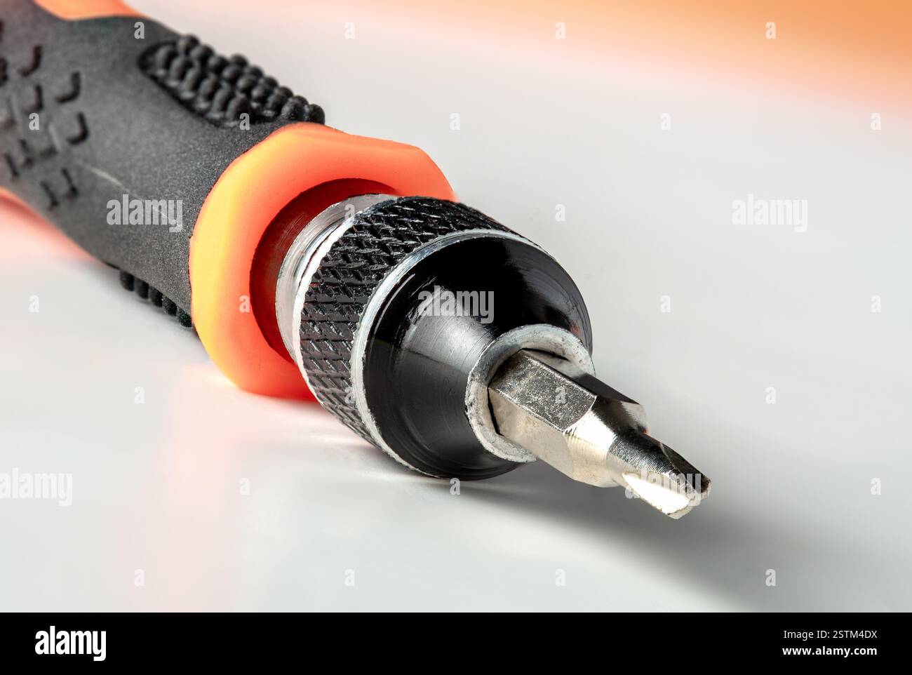 Detail of tri-point screwdriver on white background Stock Photo - Alamy