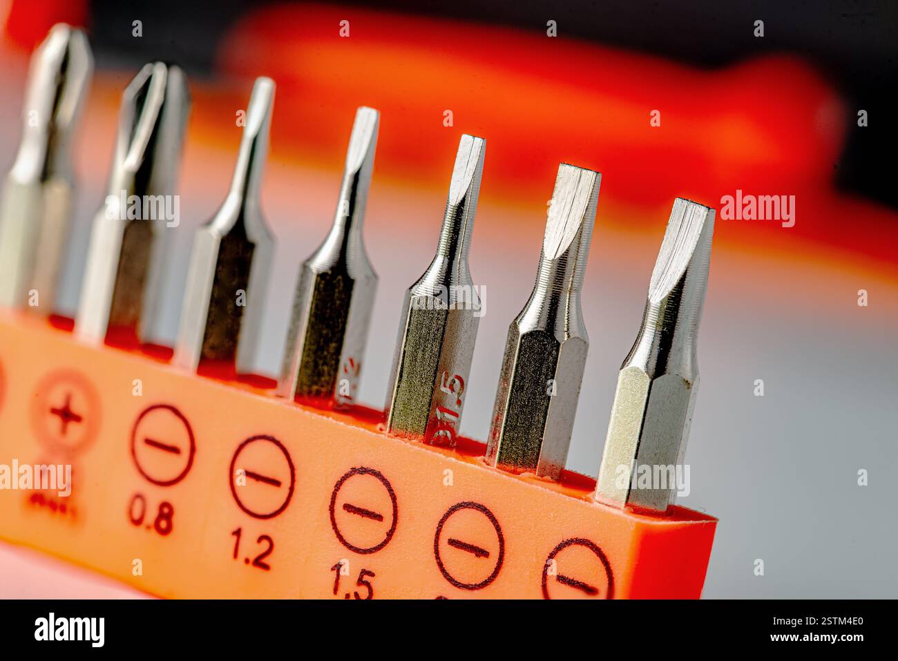 Detail of flathead magnetic precision screwdriver bits on white ...