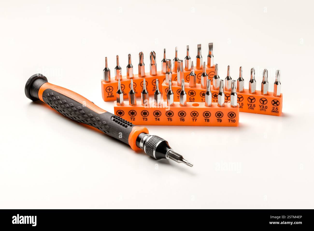 Set of magnetic precision screwdriver bits with black and orange handle ...
