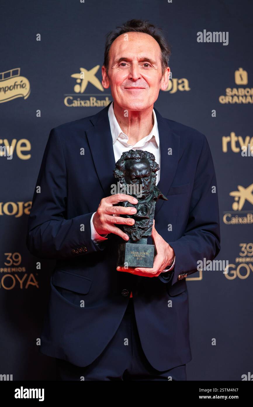 Granada, Spain. 8th February 2025. Alberto Iglesias holds the Goya Award for Original Soundtrack ...