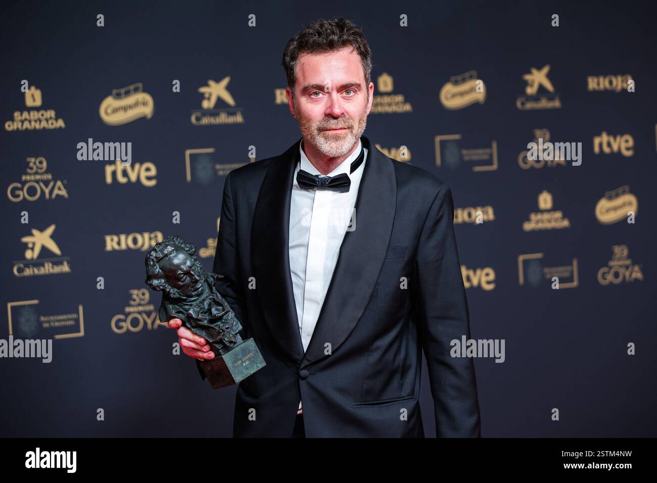 Granada, Spain. 8th February 2025. Pol Rodríguez holds the Goya Award ...